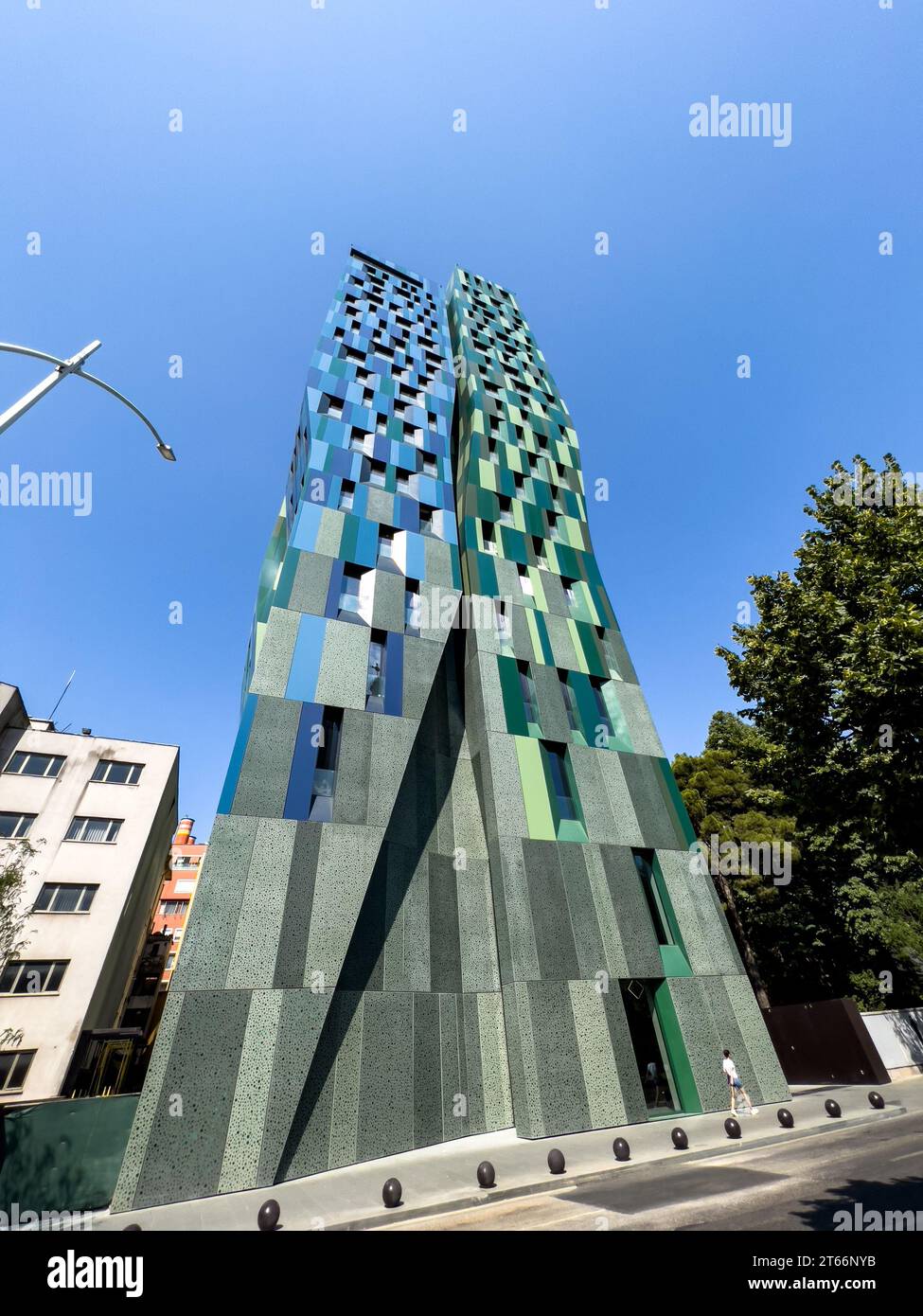 Multi-colored facade of the Forever Green Tower building against the ...