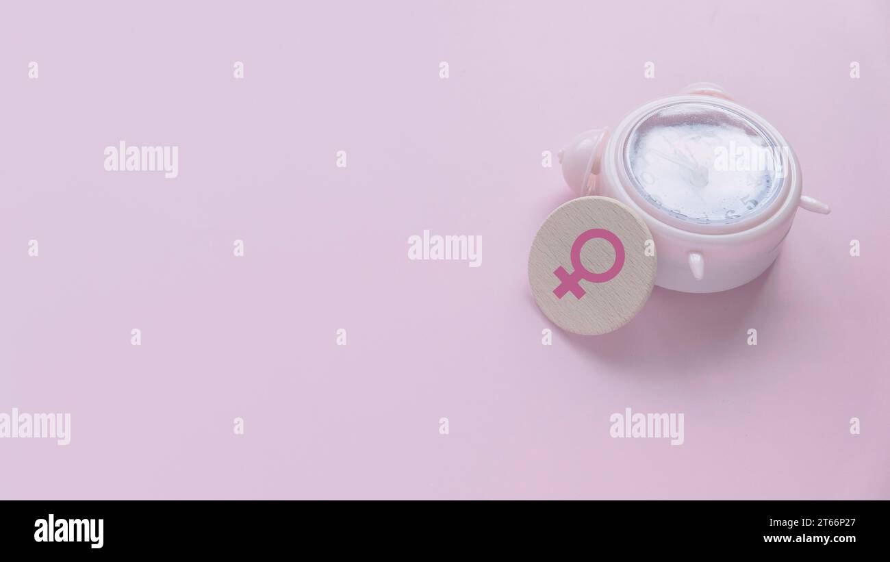 Menopause concept. Women symbol over a watch. Healthcare and medical ...
