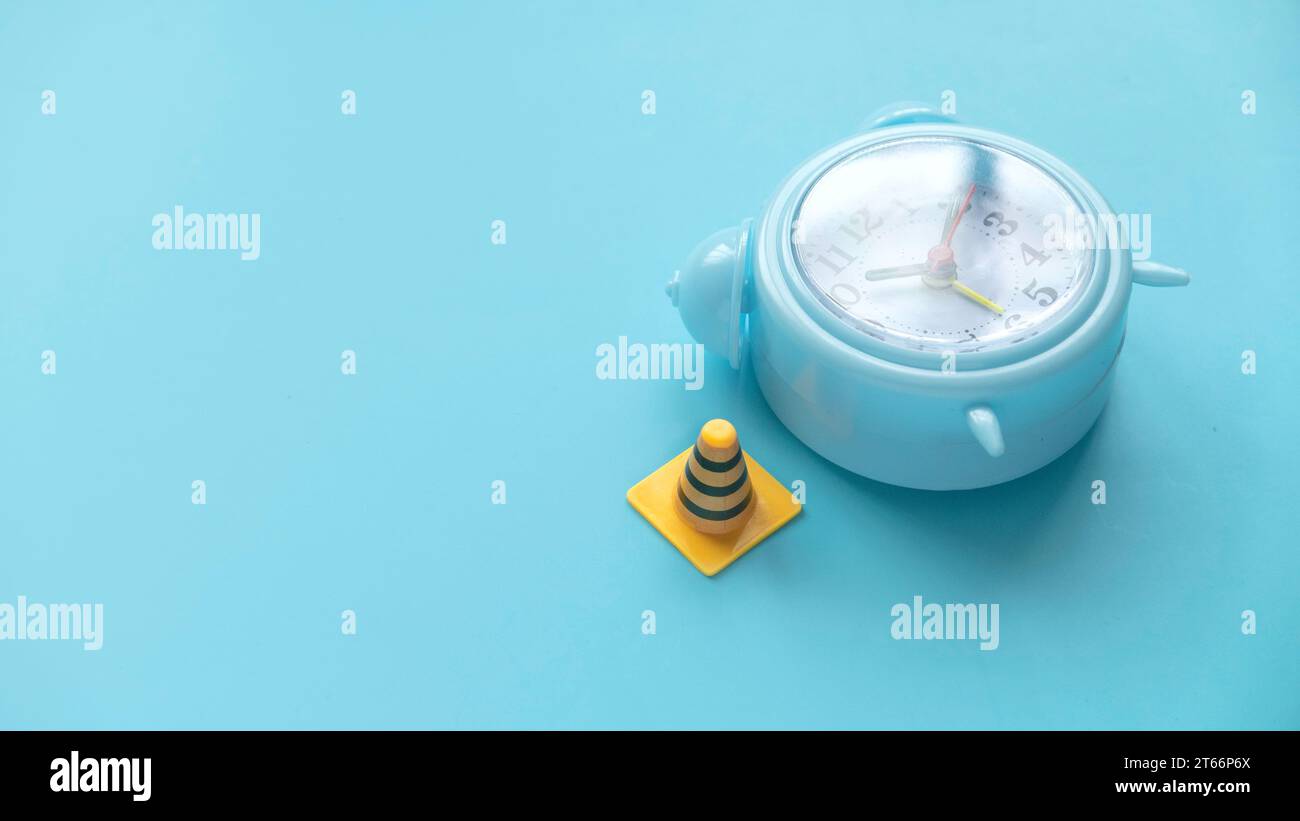 Fixing, maintenance and under construction concept. Alarm clock with ...