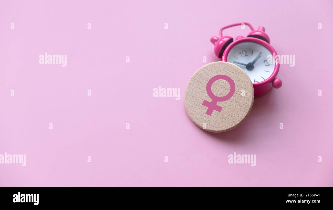 Menopause concept. Women symbol over a watch. Healthcare and medical ...