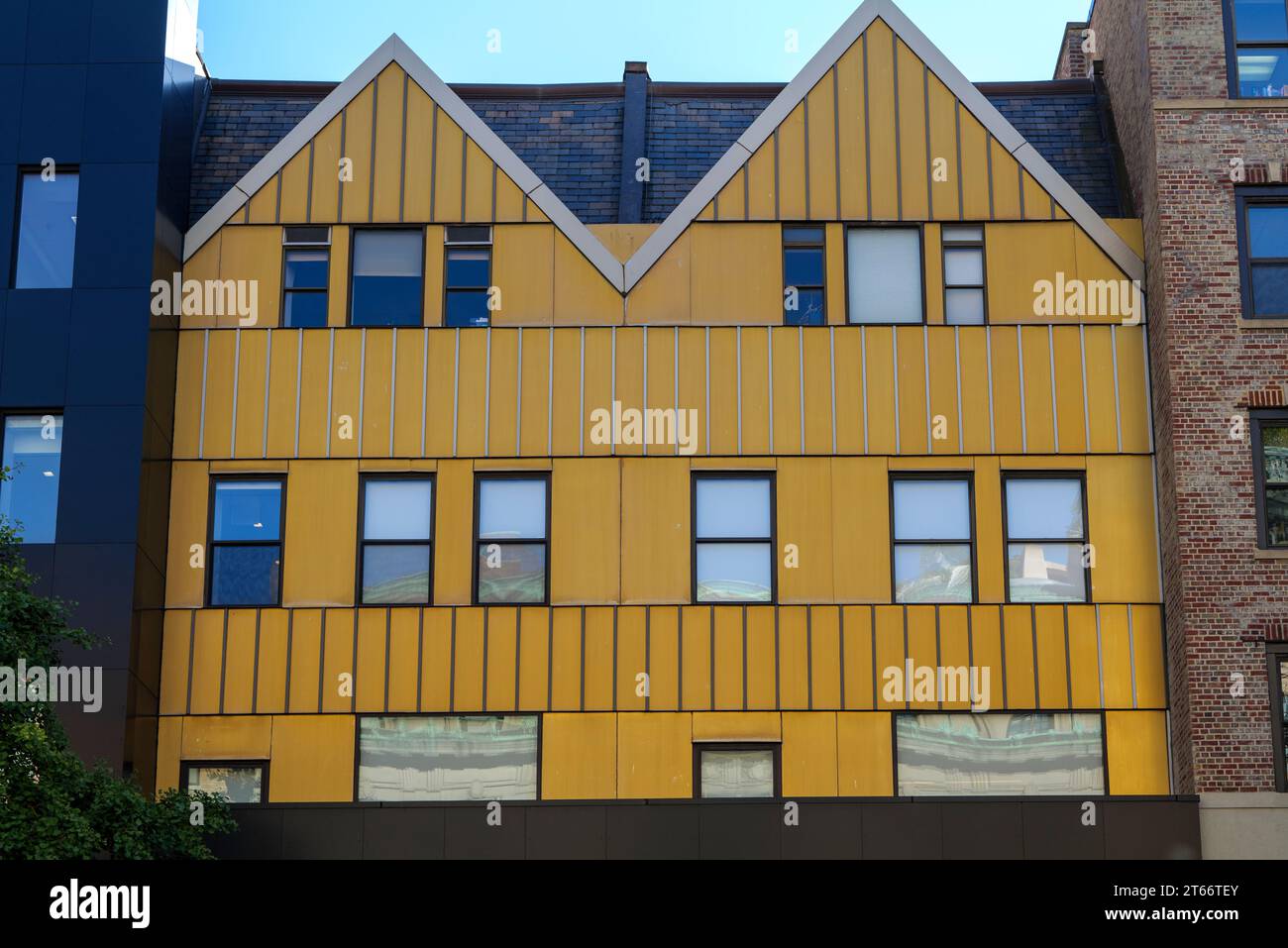 Old yellow building facade with beautiful architecture in a middle of ...