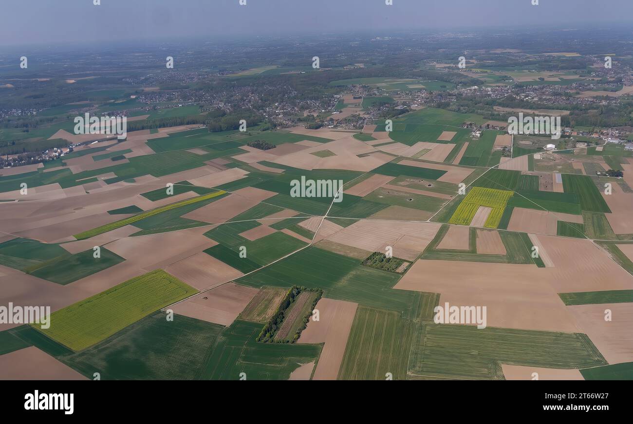 Aerial view from airplane seeing green agricultural field, farm and ...