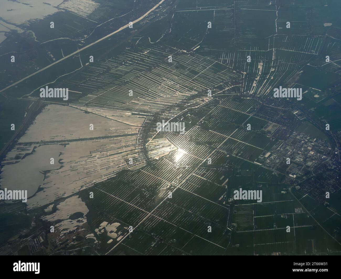 Aerial view from airplane seeing green agricultural field, farm and ...