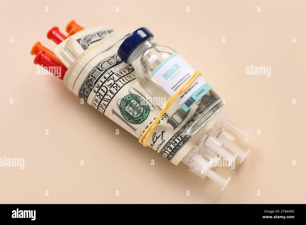 Insulin with syringes and money on beige background. Expensive medicine ...