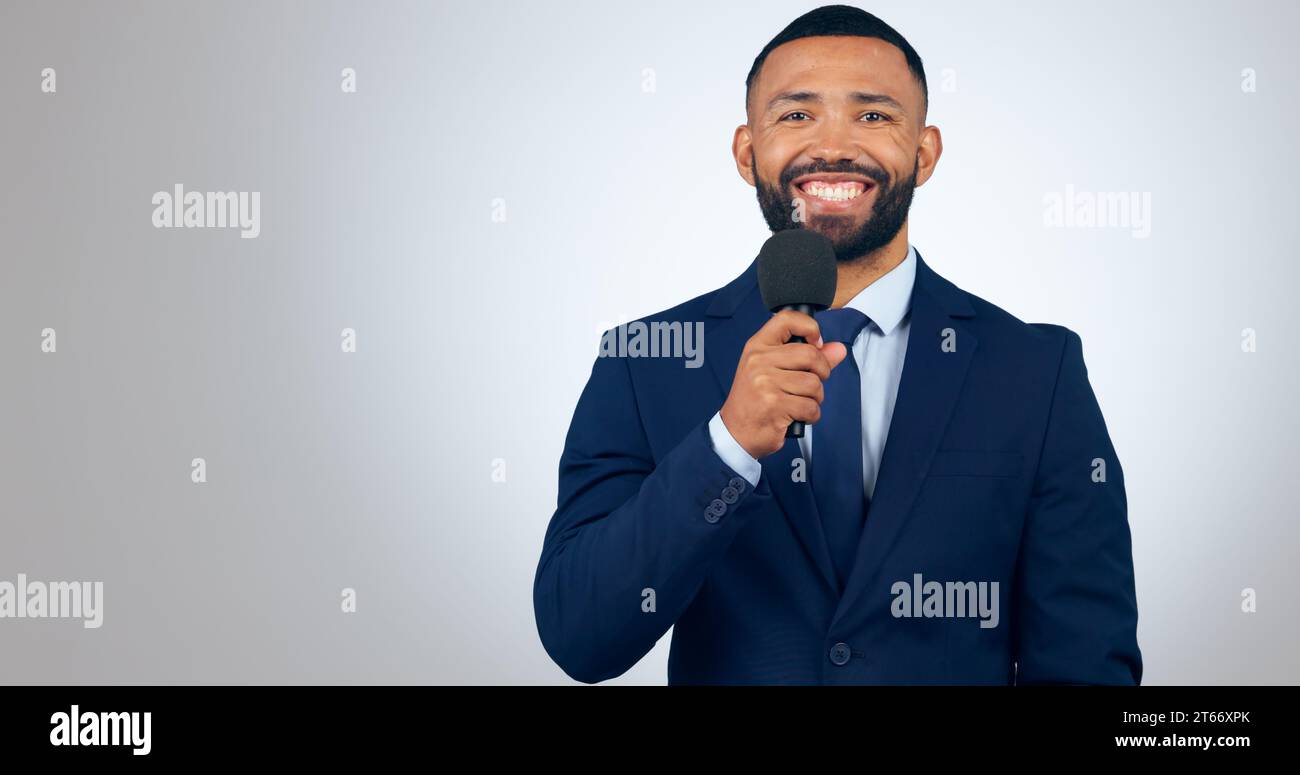 Portrait, microphone and corporate businessman in studio with smile ...
