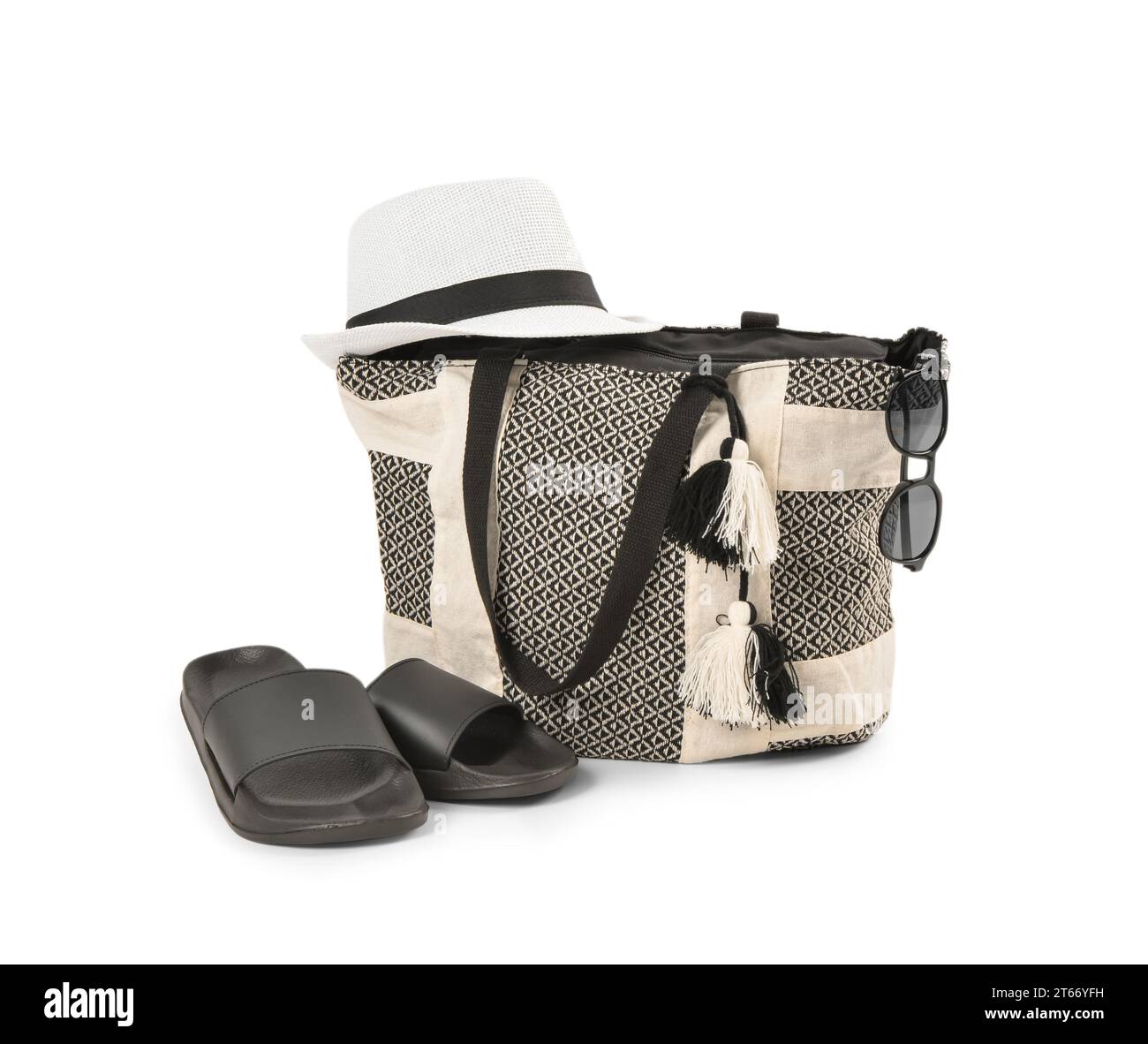 Stylish beach bag, hat, flip-flops and sunglasses on white background ...