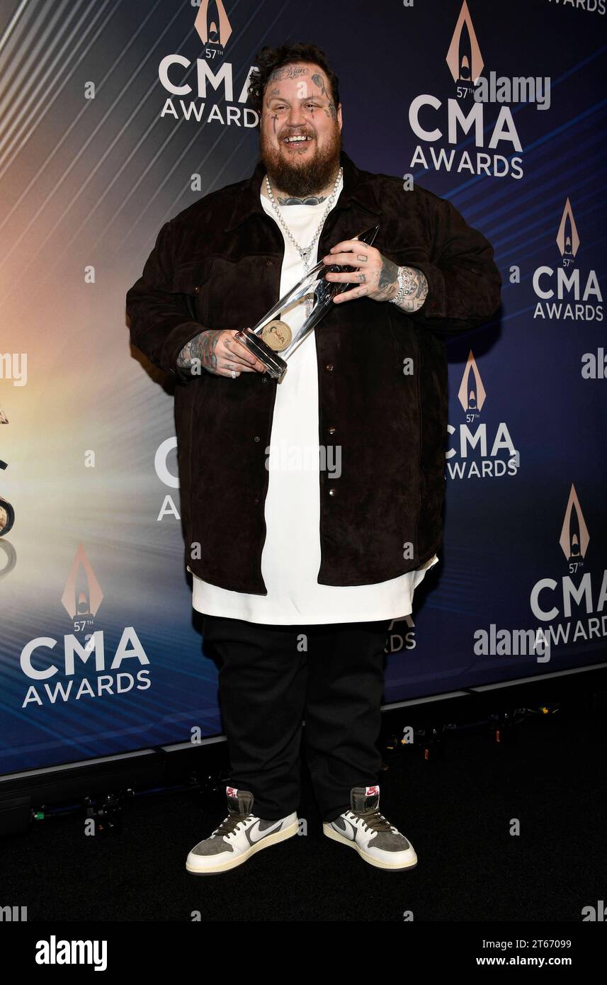 Jelly Roll poses with the award for new artist of the year in the press ...