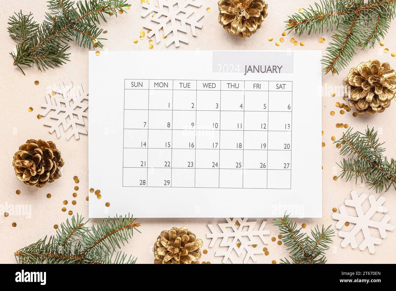 Paper calendar for January with Christmas decorations on white ...