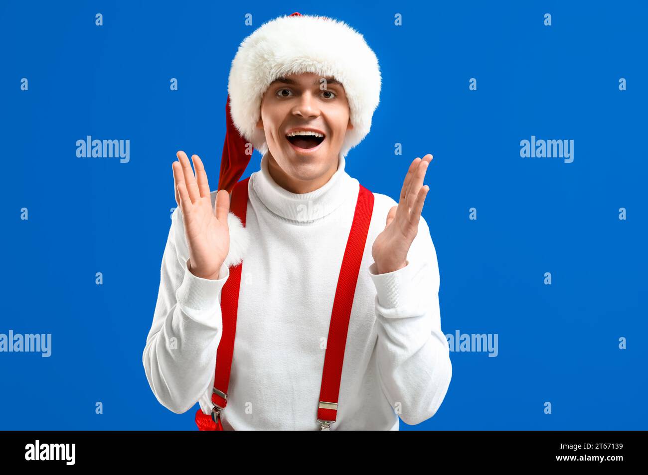 Shocked Santa Claus on blue background Stock Photo - Alamy