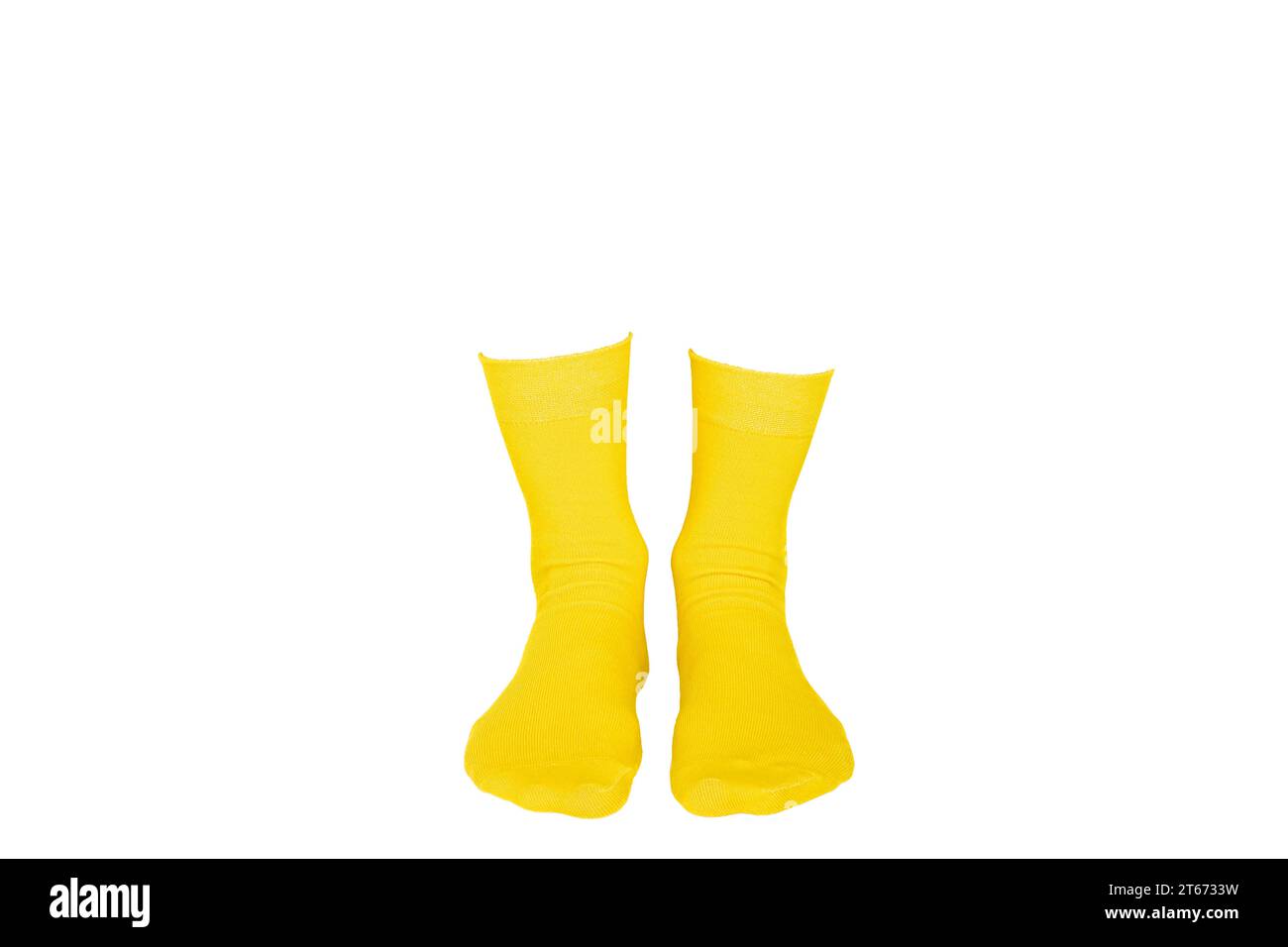 Feet in yellow socks on a white background without people, fashion and ...