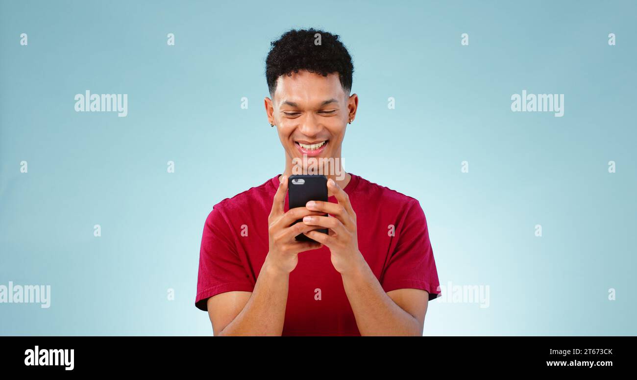 Man, smile and texting on phone in studio for communication mock up on ...