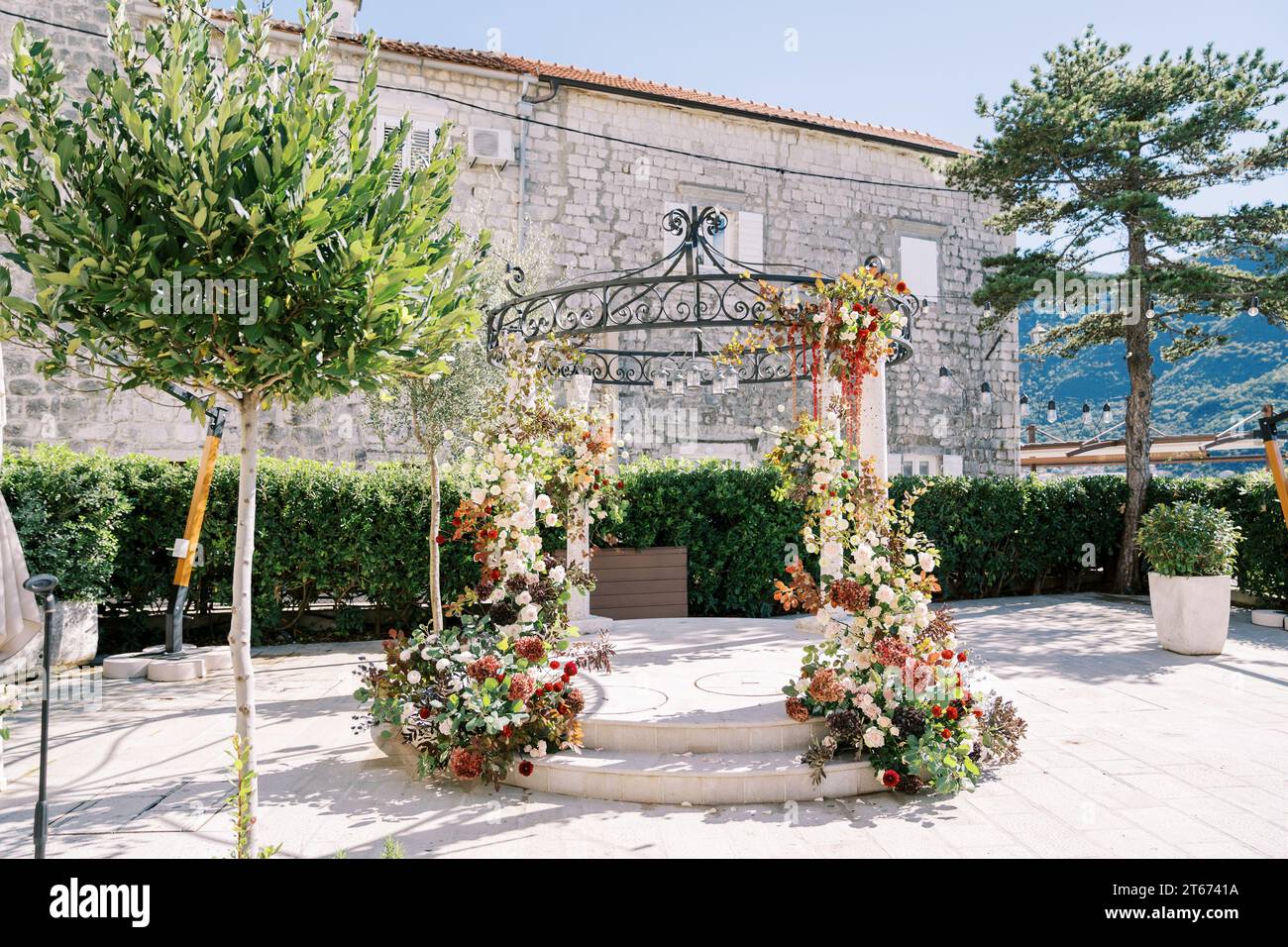 Alcove with columns decorated with flowers in the courtyard of an ...