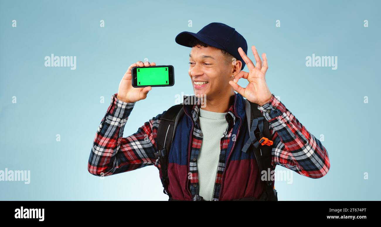 Hiking, green screen and man with a smartphone, ok sign and happiness ...