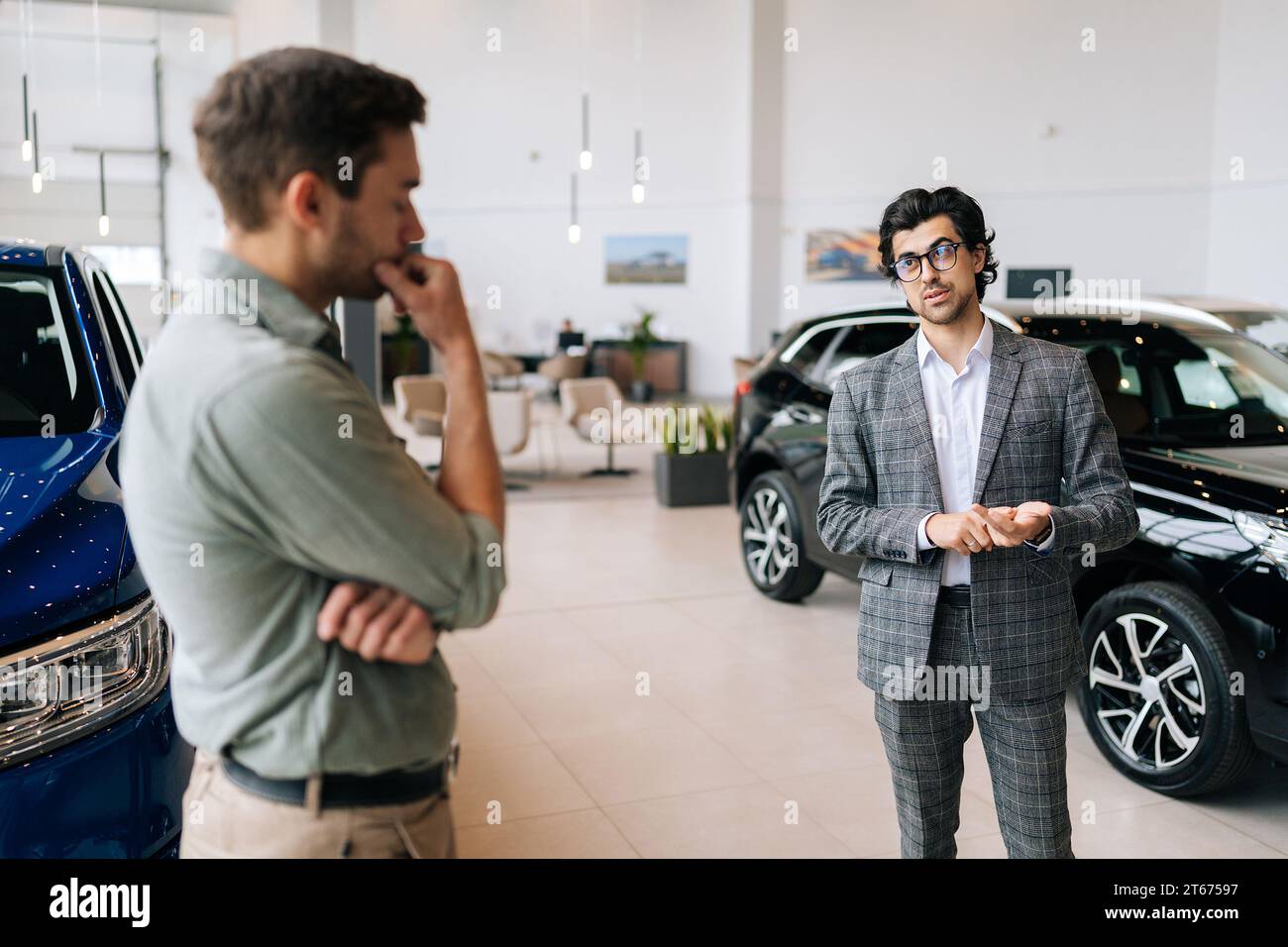 Male dealer presenting luxury car hi-res stock photography and images ...