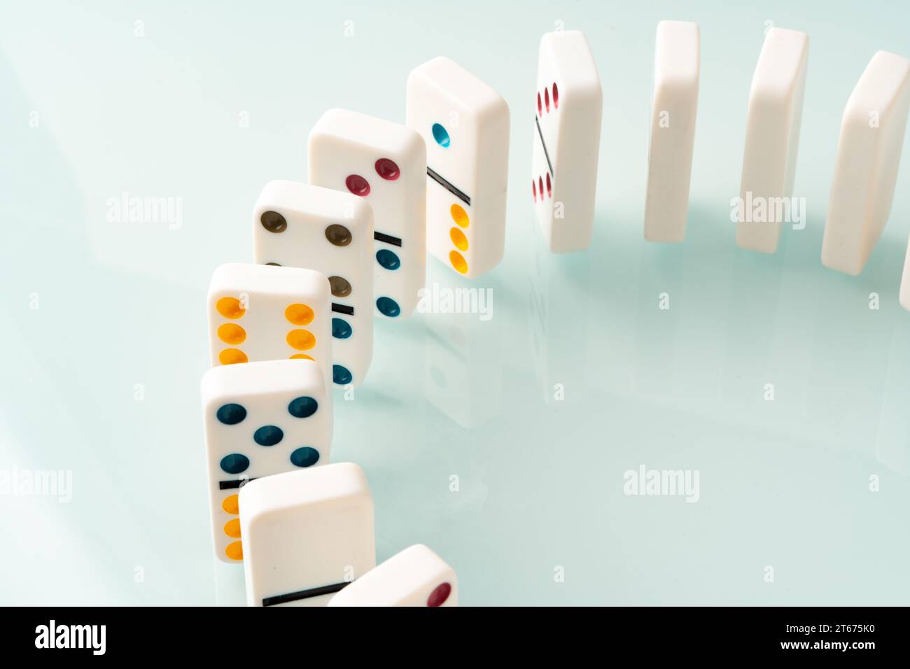 Domino tiles in a row on white background Stock Photo - Alamy