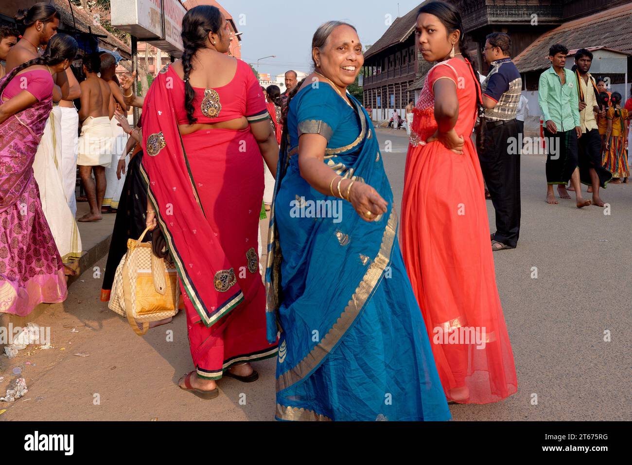 Three Indian women in traditional dress visiting Padmanabhaswamy Temple ...