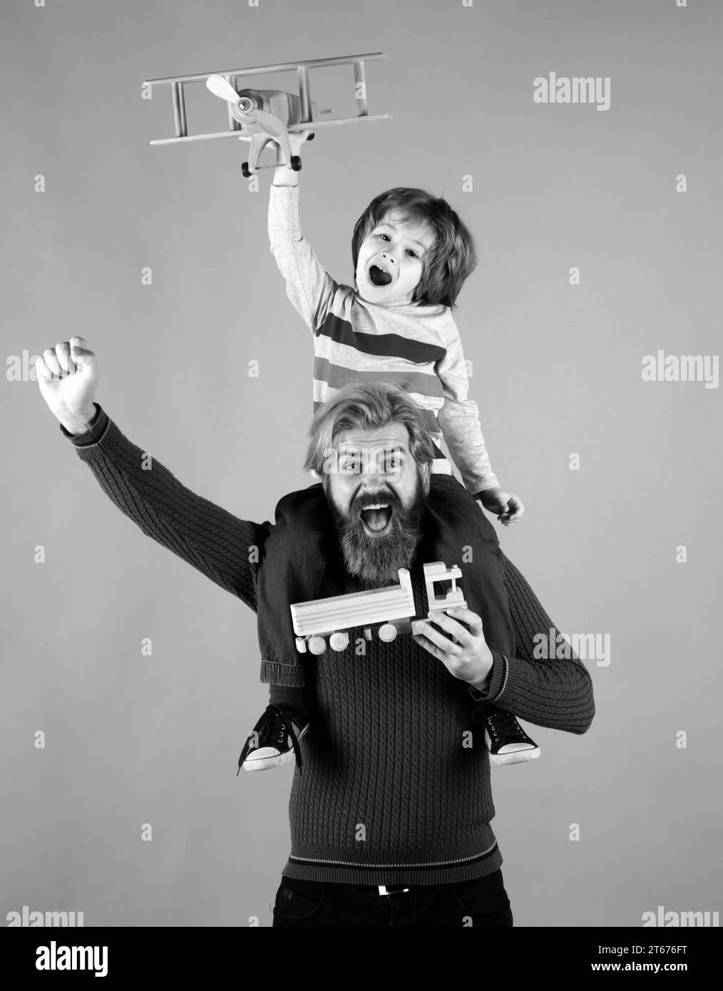 Father and son. Child pilot aviator with airplane dreams of traveling ...