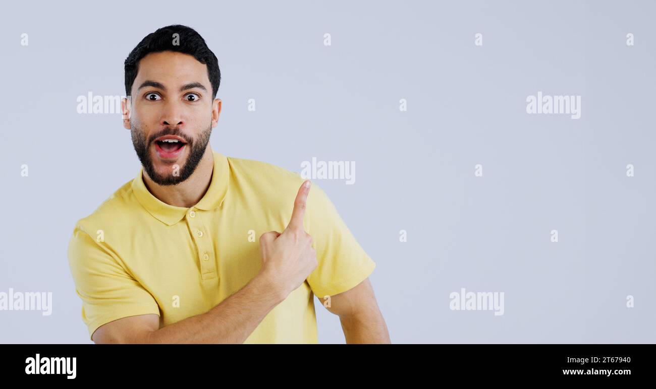 Man, portrait and pointing up in surprise on mockup for deal ...