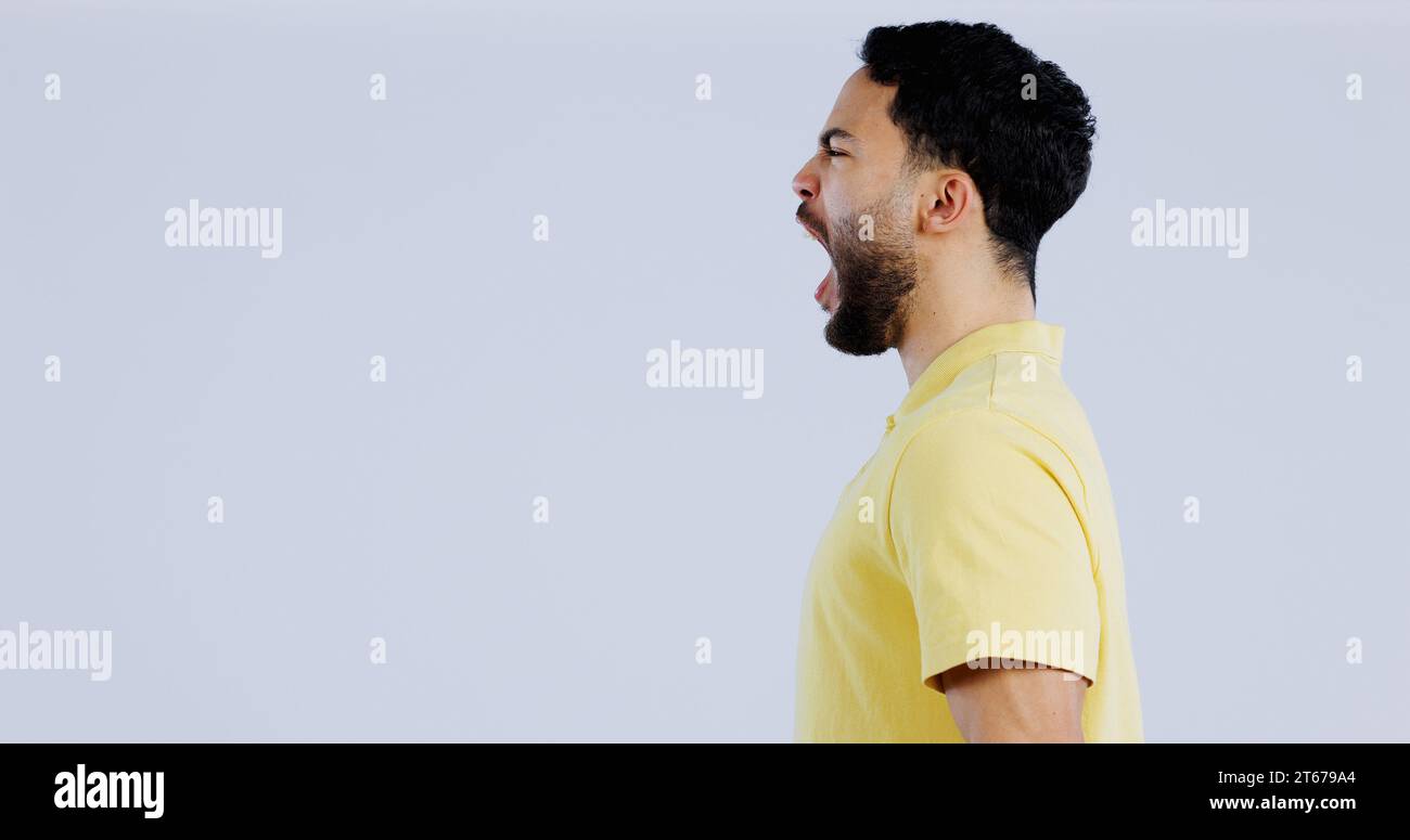 Scream, angry and man in studio at mockup space for crisis, conflict ...