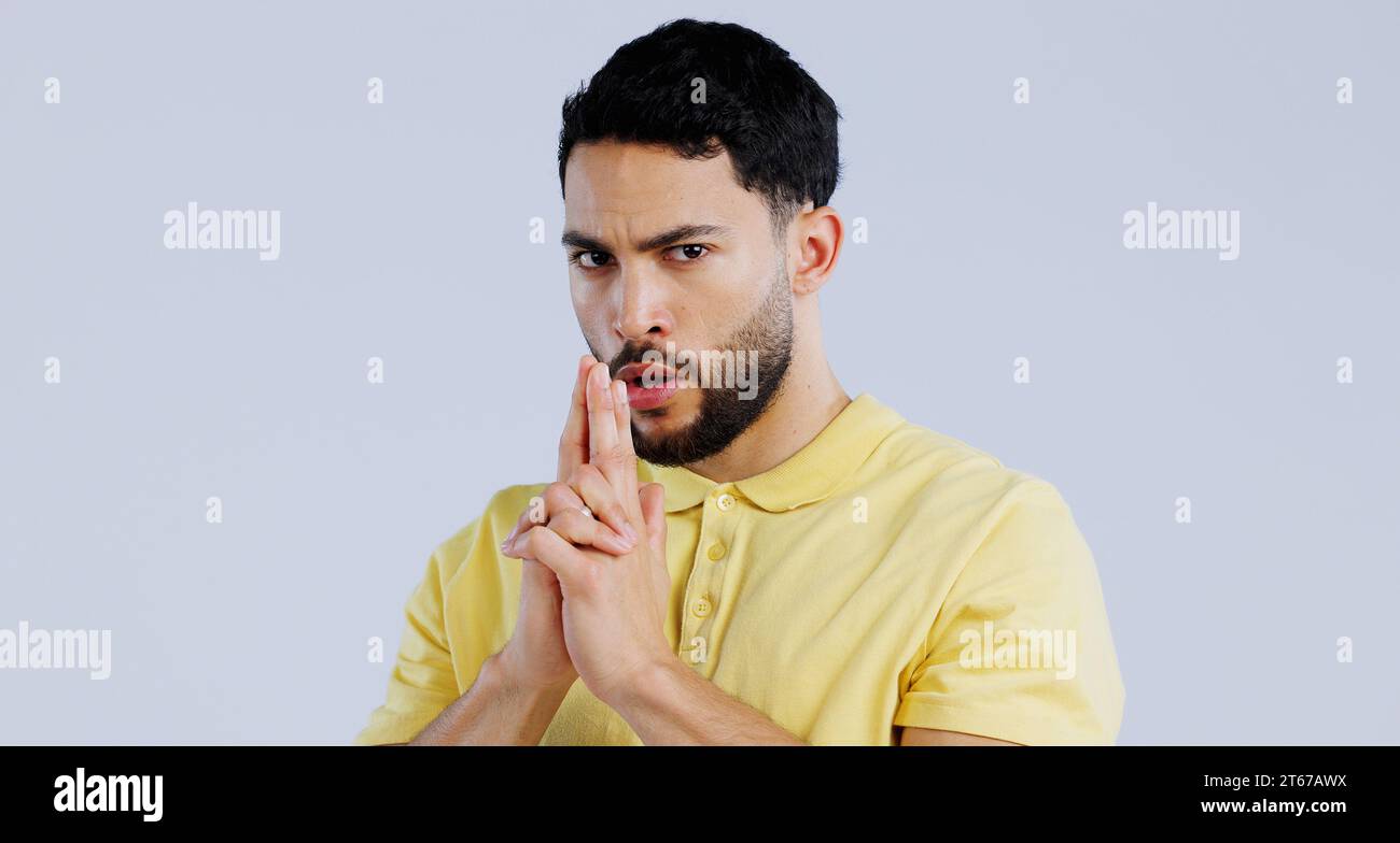 Finger gun, serious and portrait of man in studio with aim for target ...