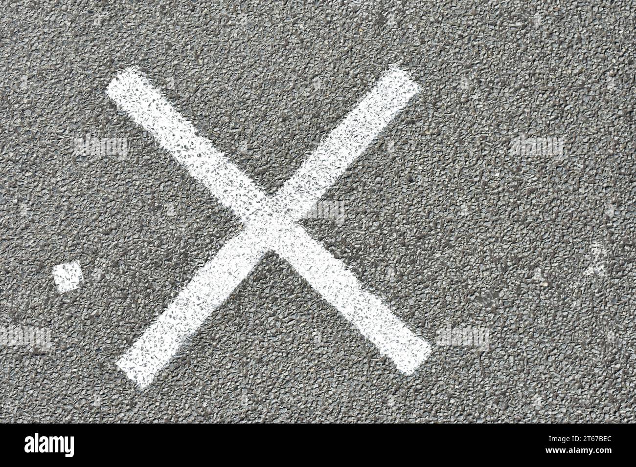 White painted x road or street sign marking the spot Stock Photo - Alamy