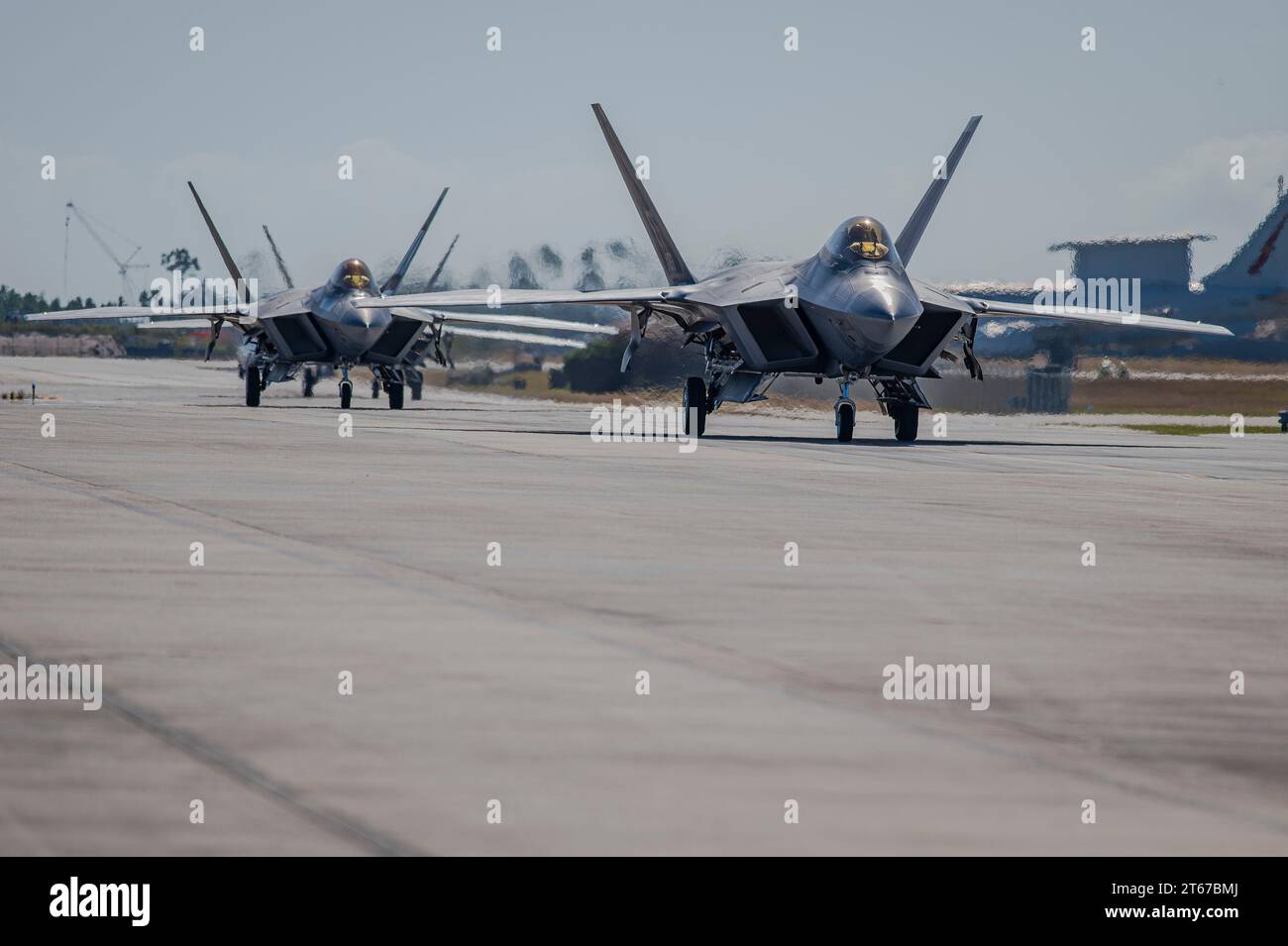 U.S. Air Force F-22 Raptors taxi on the flight line after arriving for ...