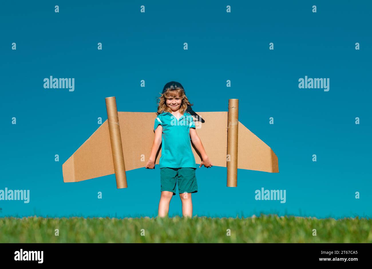 Kid with jet pack superhero. Child pilot against summer sky background ...
