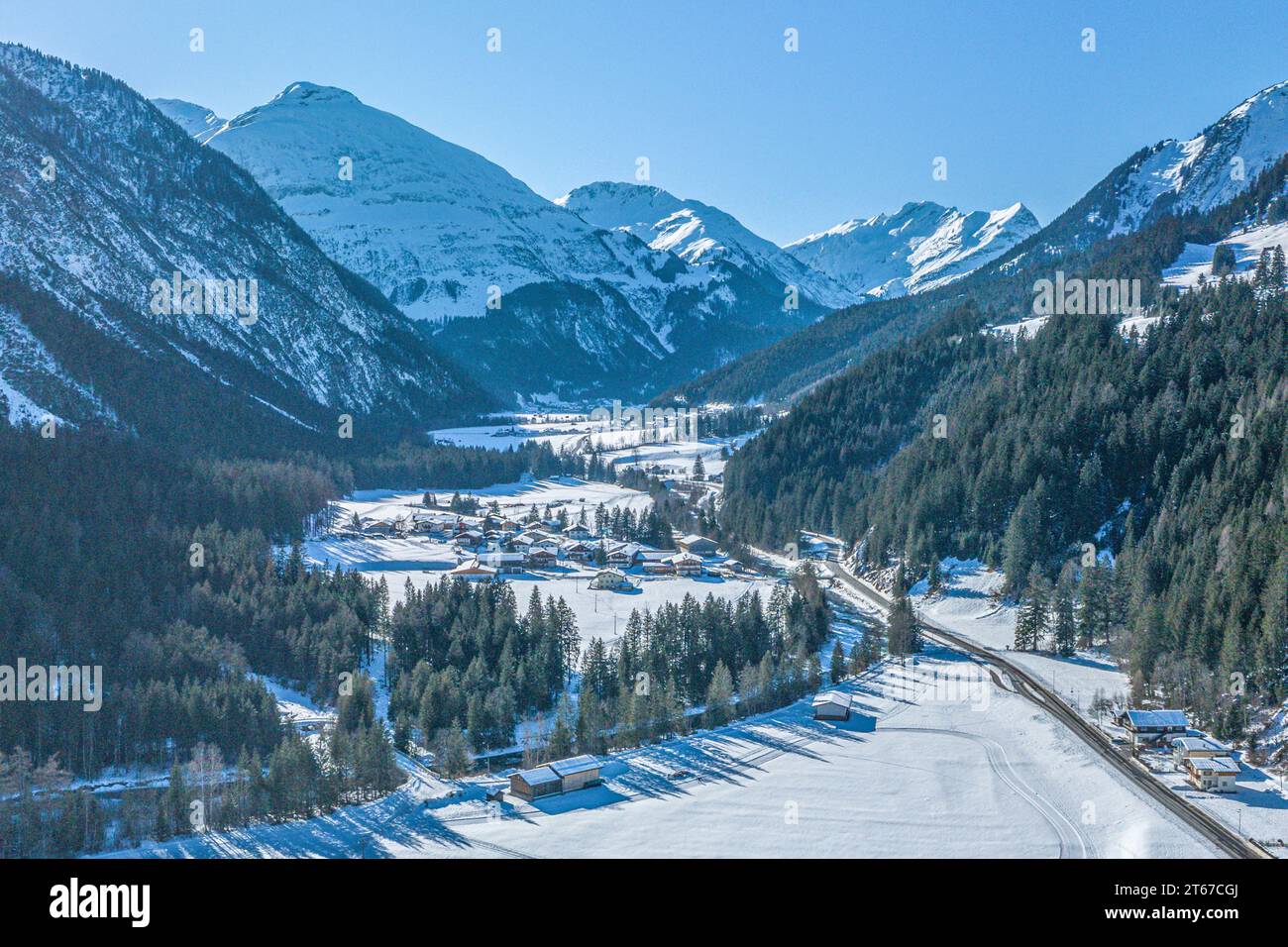 The village of Holzgau in the tyrolean Lech Valley in winter from above ...
