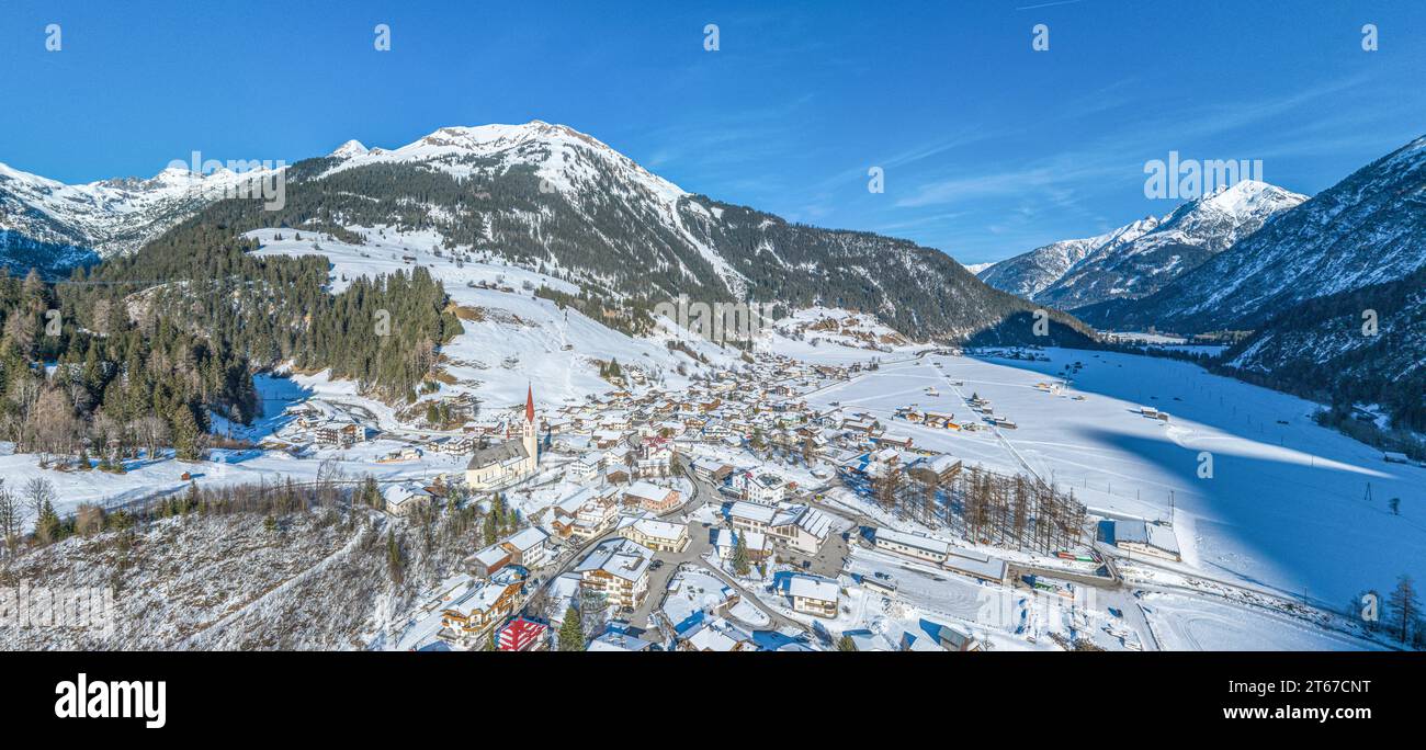 The village of Holzgau in the tyrolean Lech Valley in winter from above ...