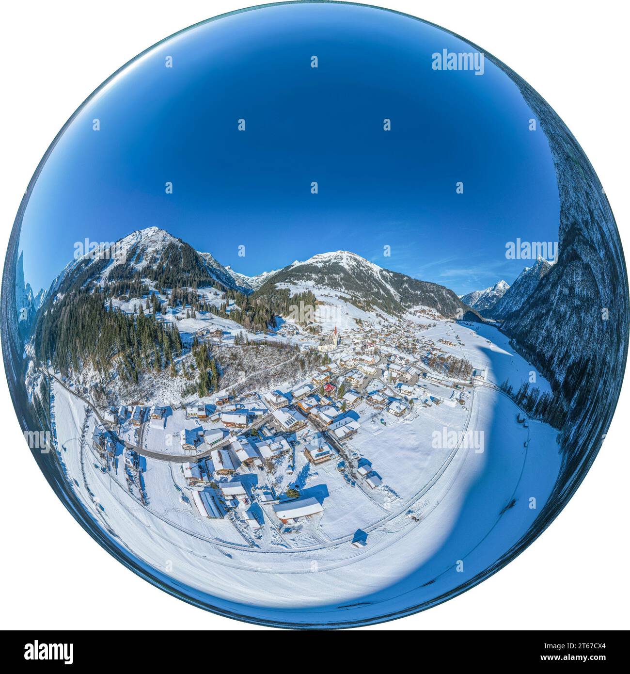 The village of Holzgau in the tyrolean Lech Valley in winter from above ...