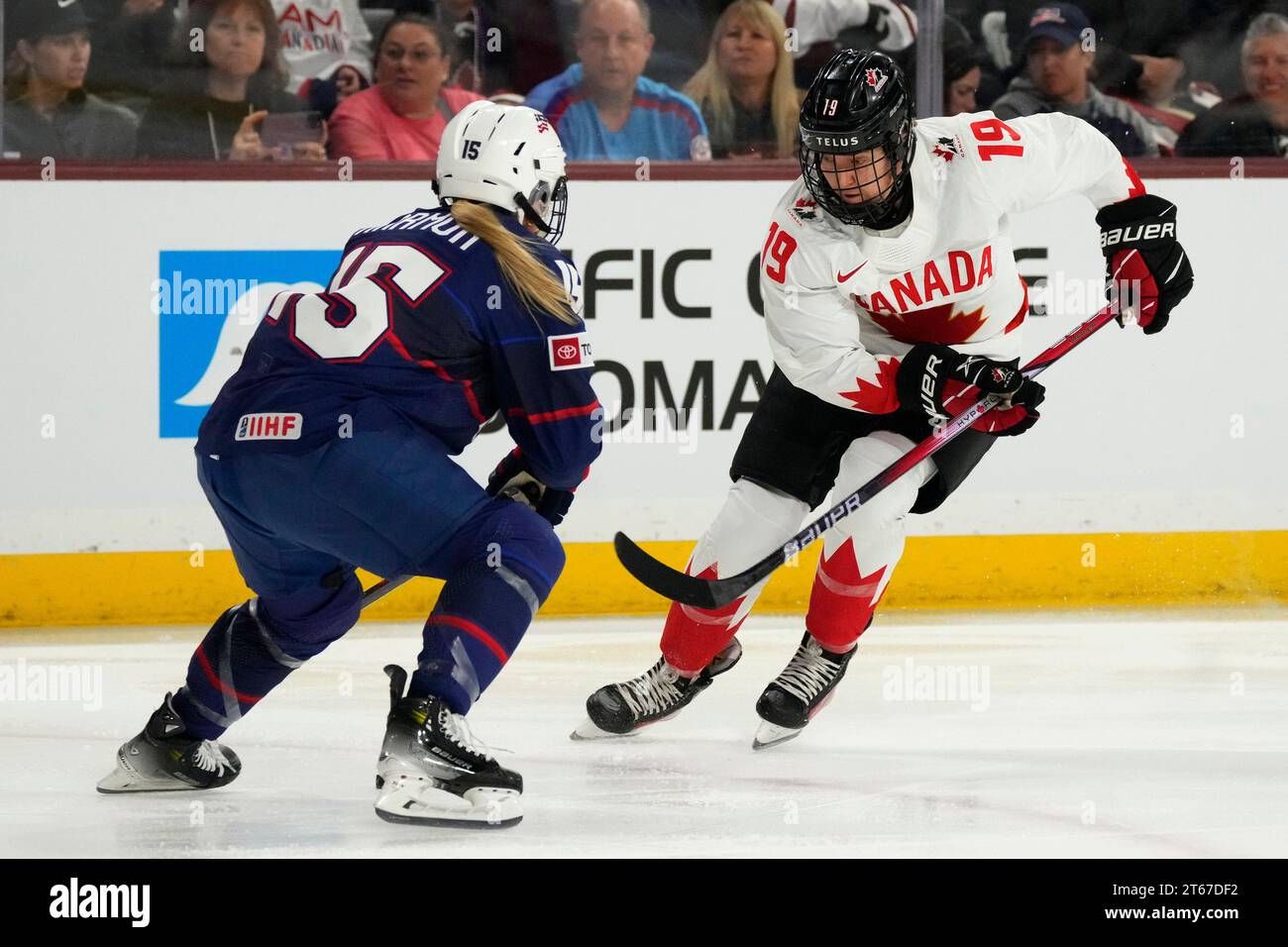 Canada forward Brianne Jenner (19) flips the puck past United States ...