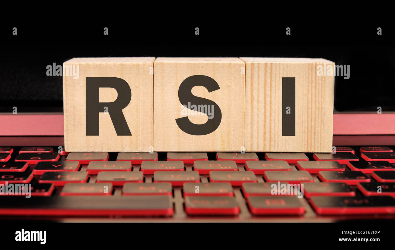 RSI Relative Strength Index written on wooden cubes on the laptop ...