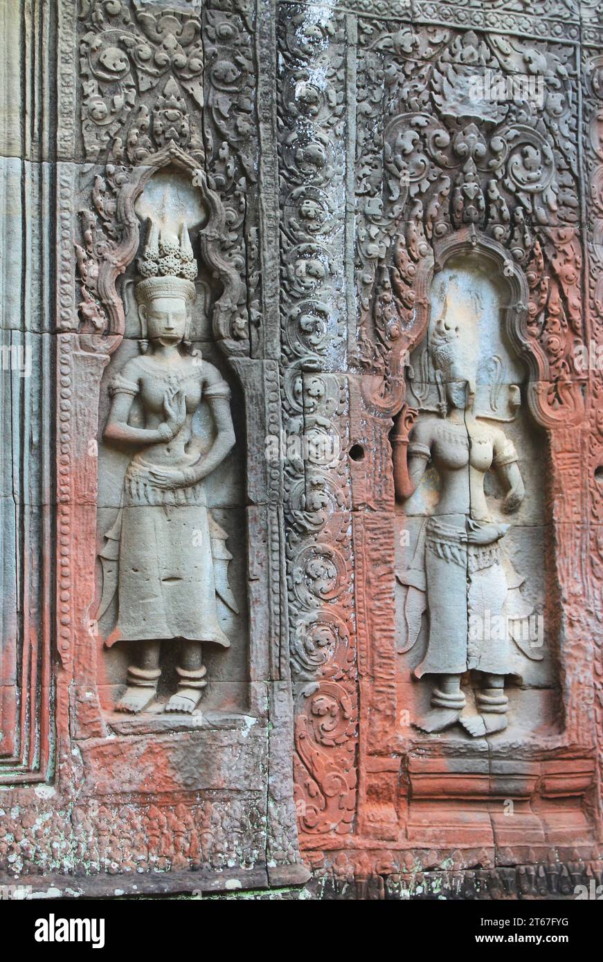 Carved stone Devata figures adorn a wall in the Angkor Archaeological ...