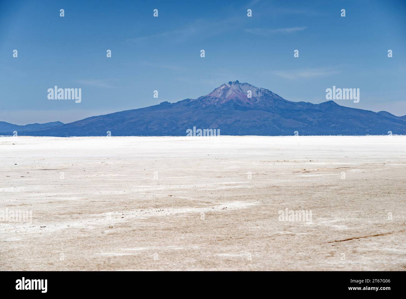 daytime landscape of famous Tunupa volcano behind Salar de Uyuni salts ...