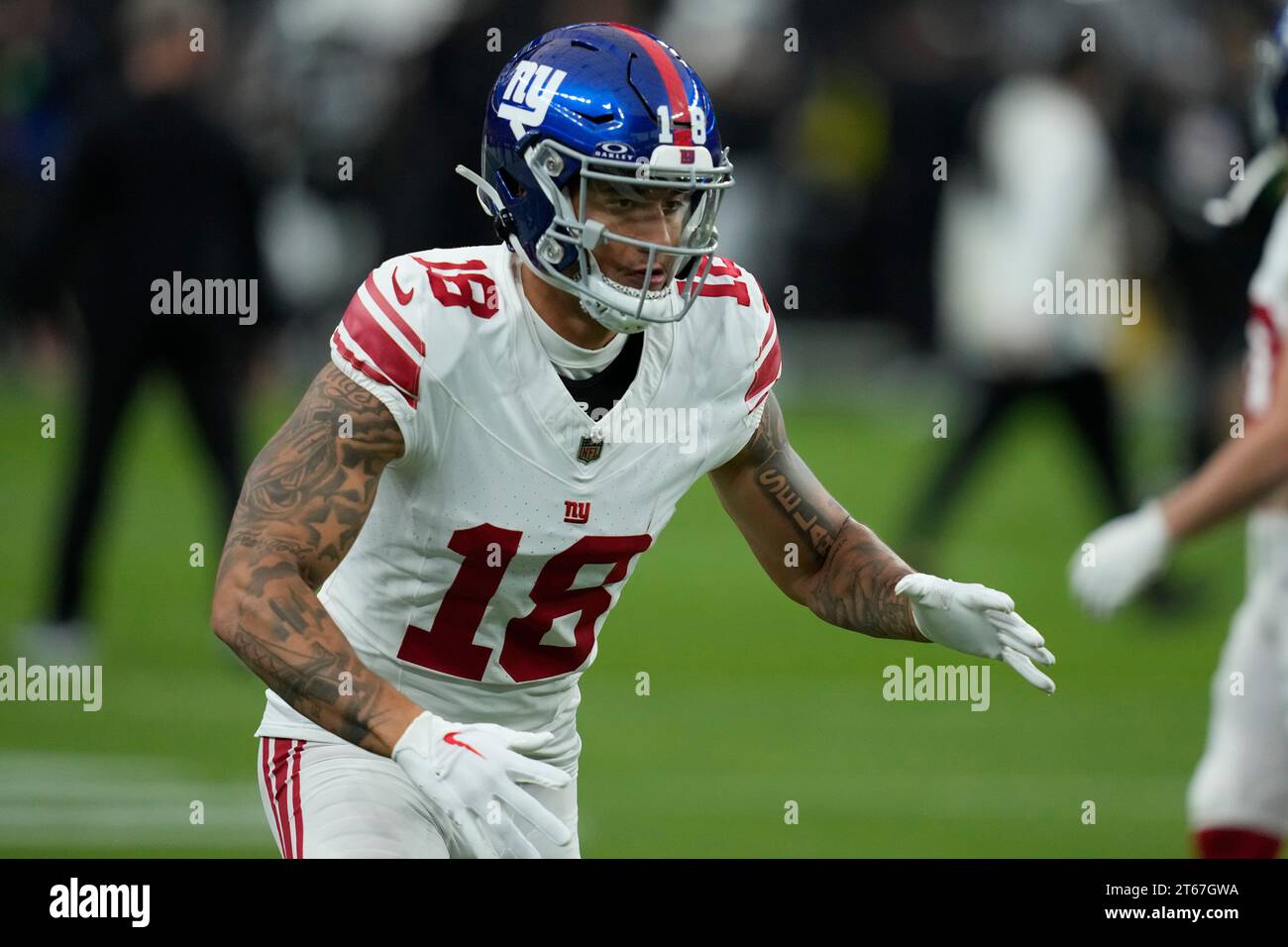 New York Giants wide receiver Isaiah Hodgins (18) warms up before an ...