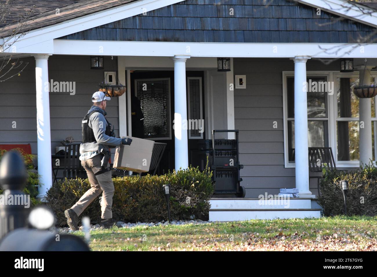 Helmetta, United States. 08th Nov, 2023. FBI agents carry boxes of ...