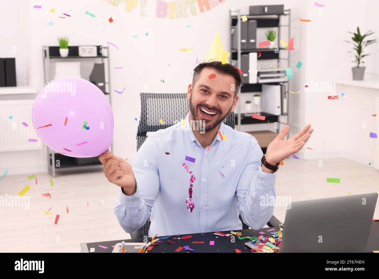 Man having fun during office party at workplace Stock Photo - Alamy