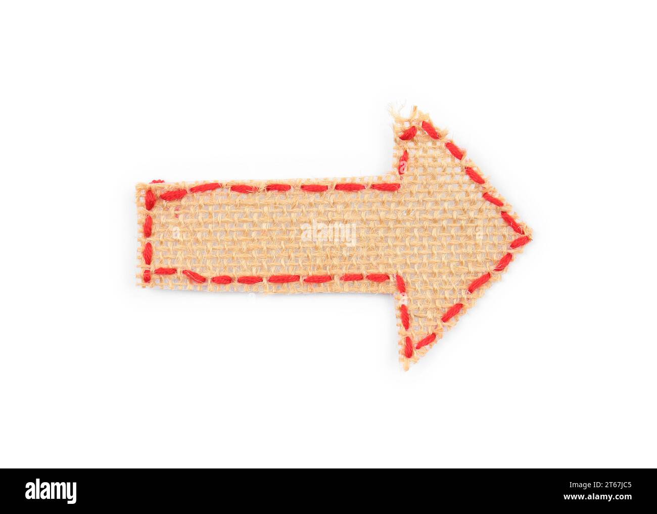 Arrow made of burlap fabric with red stitches isolated on white, top ...