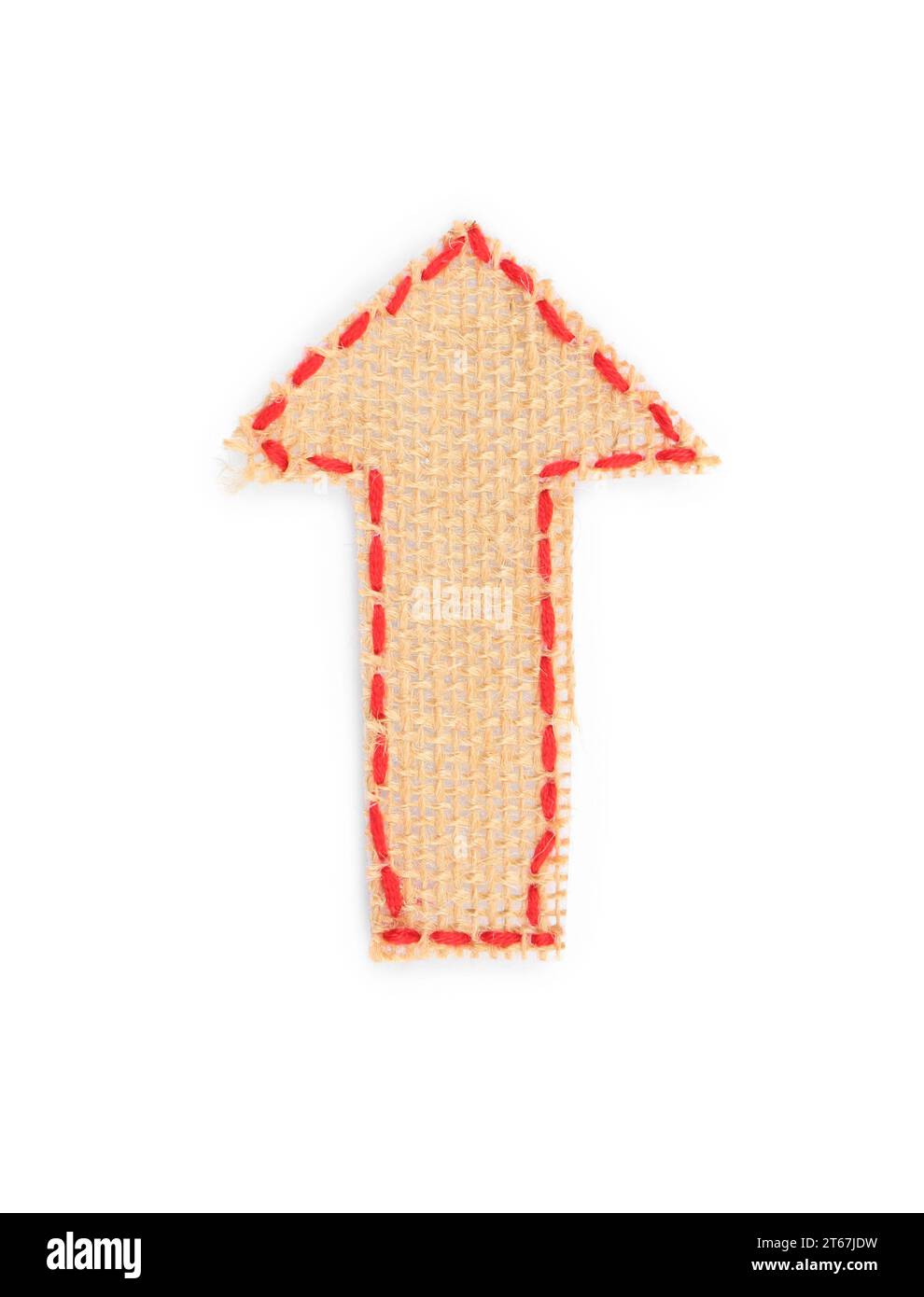 Arrow made of burlap fabric with red stitches isolated on white, top ...
