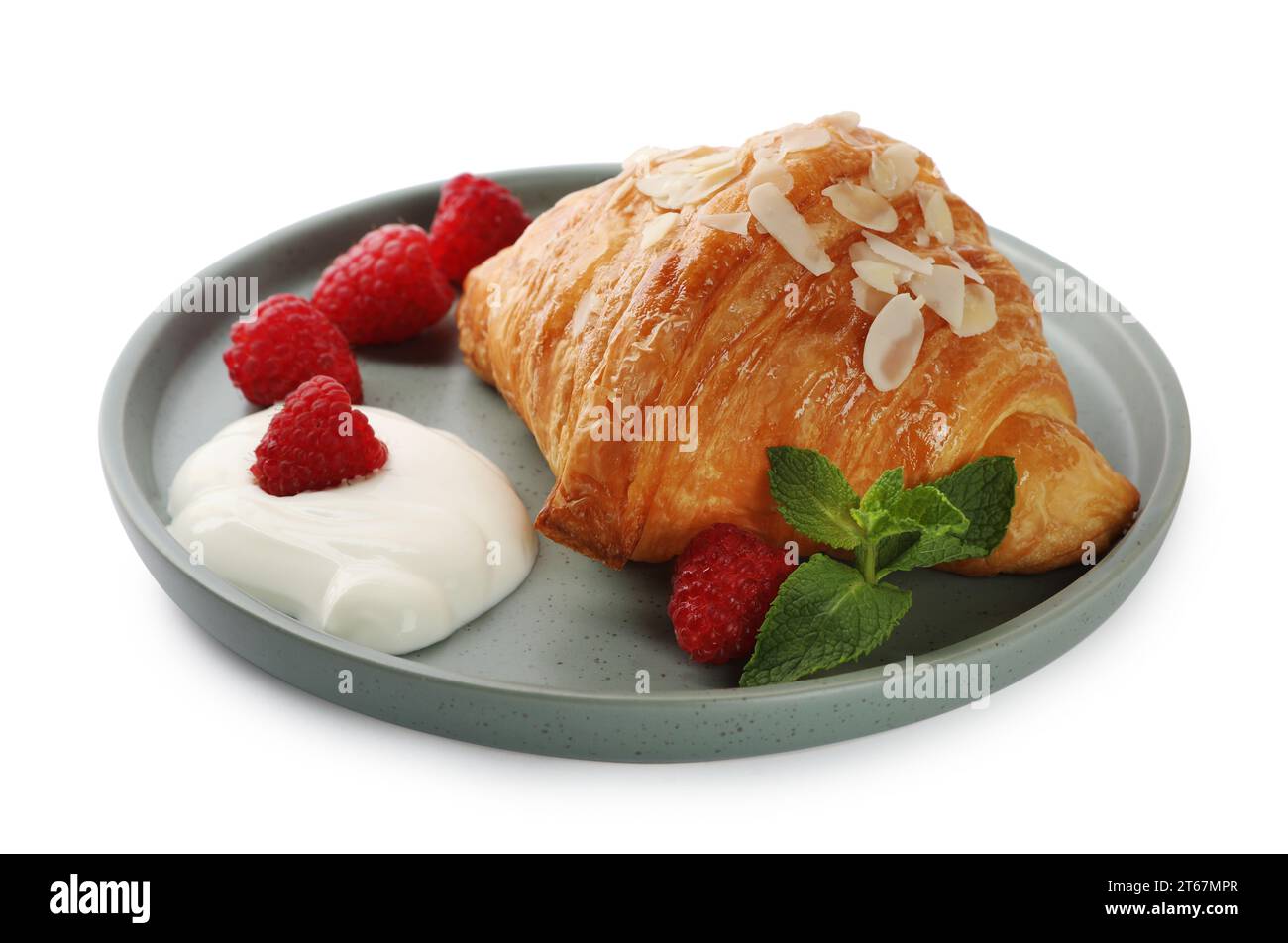 Delicious croissant, cream cheese and raspberries isolated on white ...