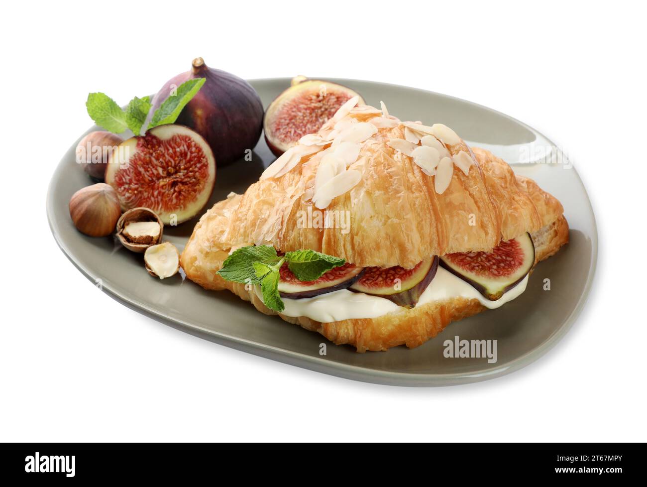 Delicious croissant with cream cheese, figs and hazelnuts isolated on ...