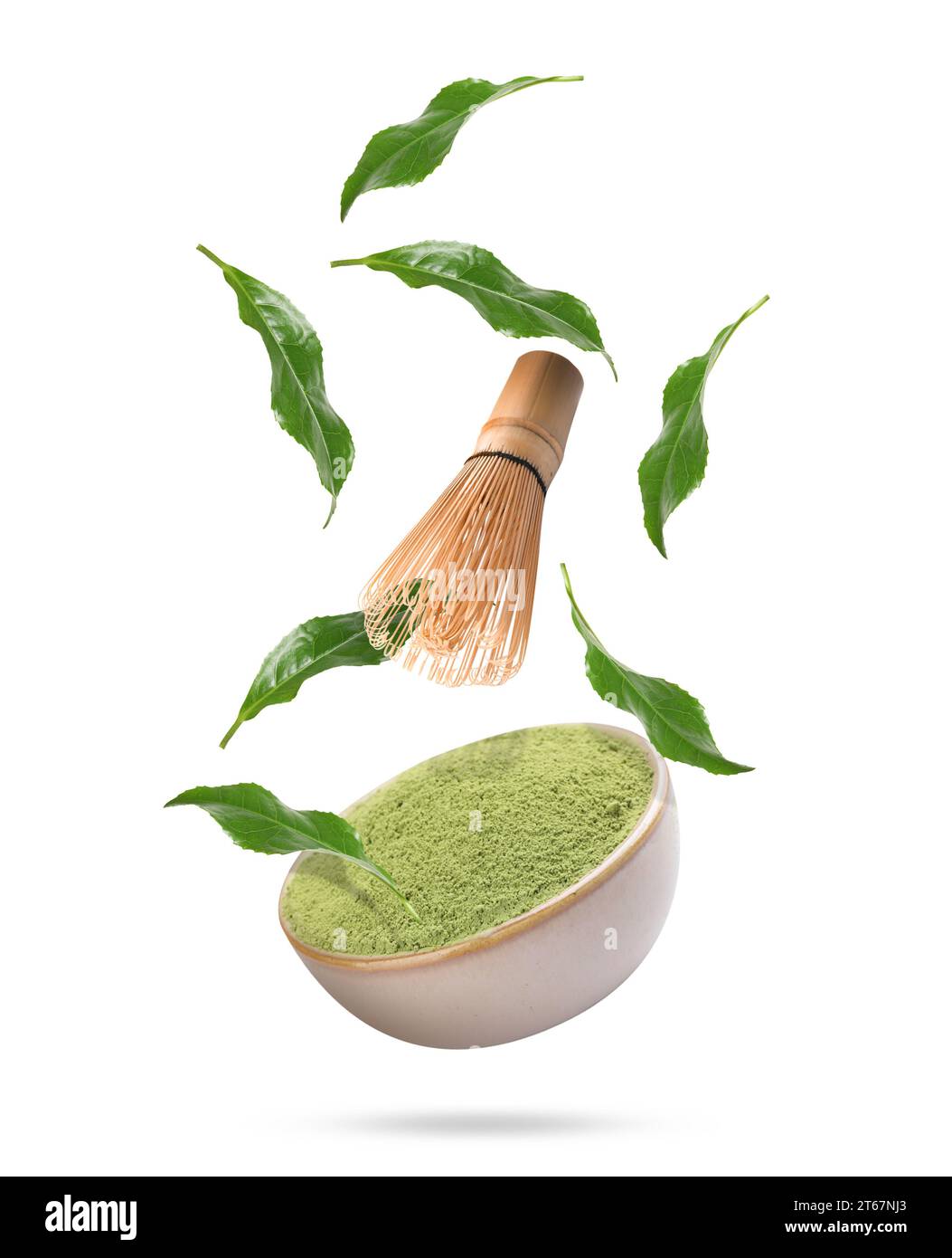 Green matcha powder in bowl, whisk and leaves falling on white ...
