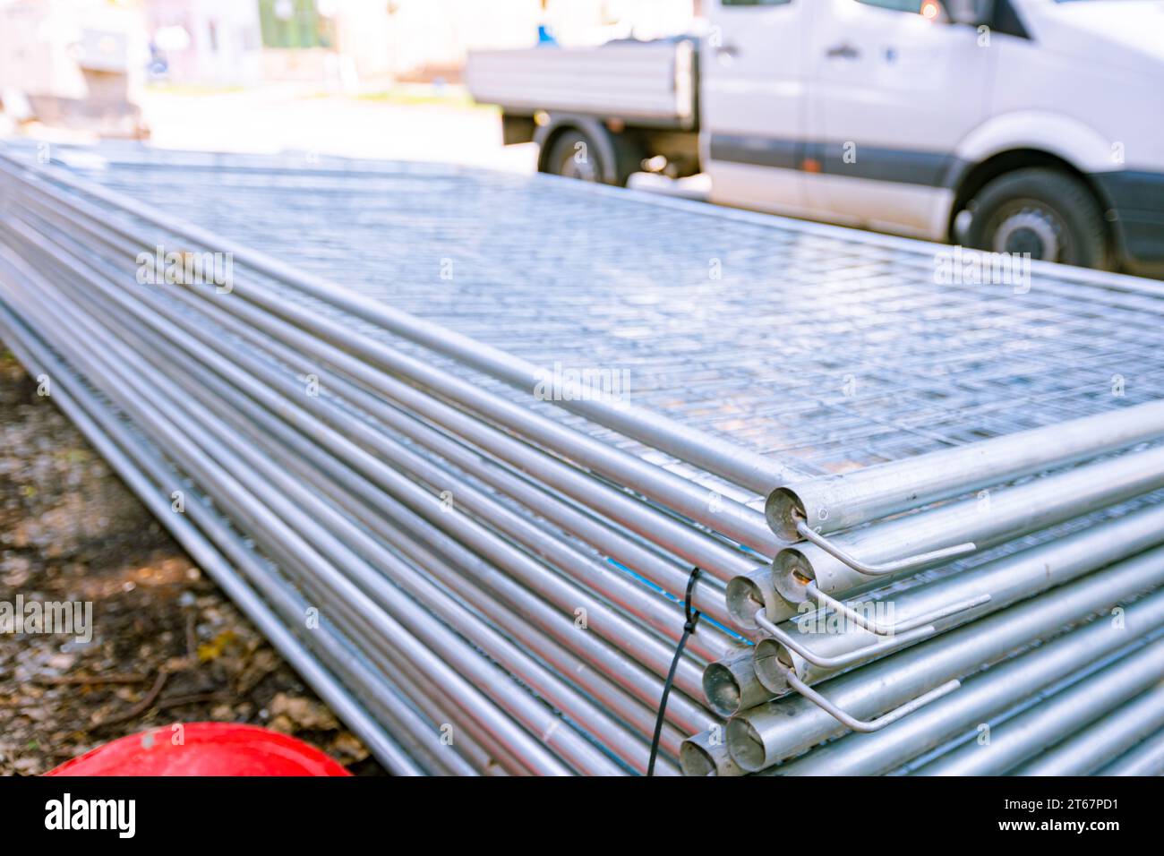 Pile, heap of galvanized parts for temporary metal wire fence panels ...