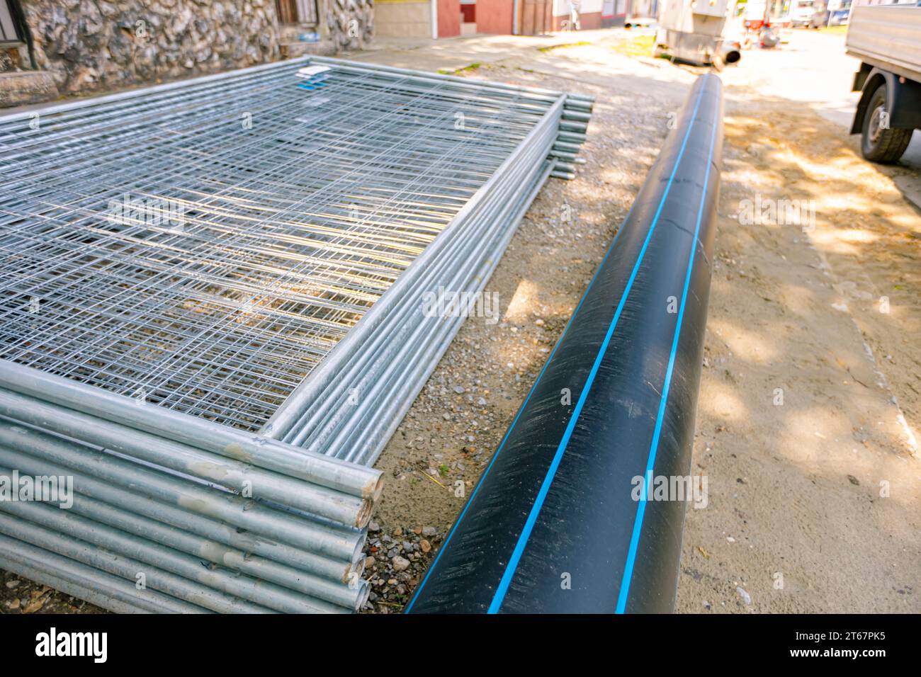 Pile, heap of galvanized parts for temporary metal wire fence panels ...