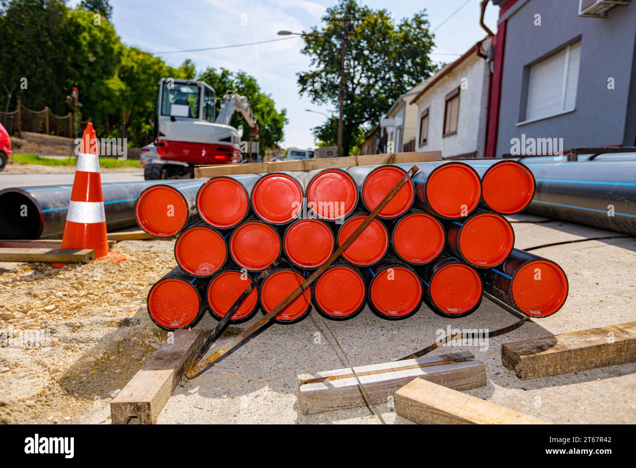 Several orange traffic cones are symbols of caution next to package of ...