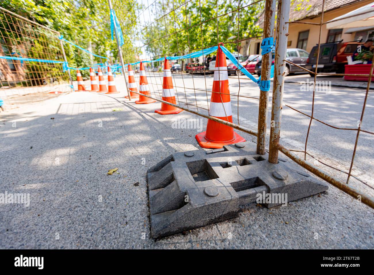 Barricade installed in front of building site next to city road with ...