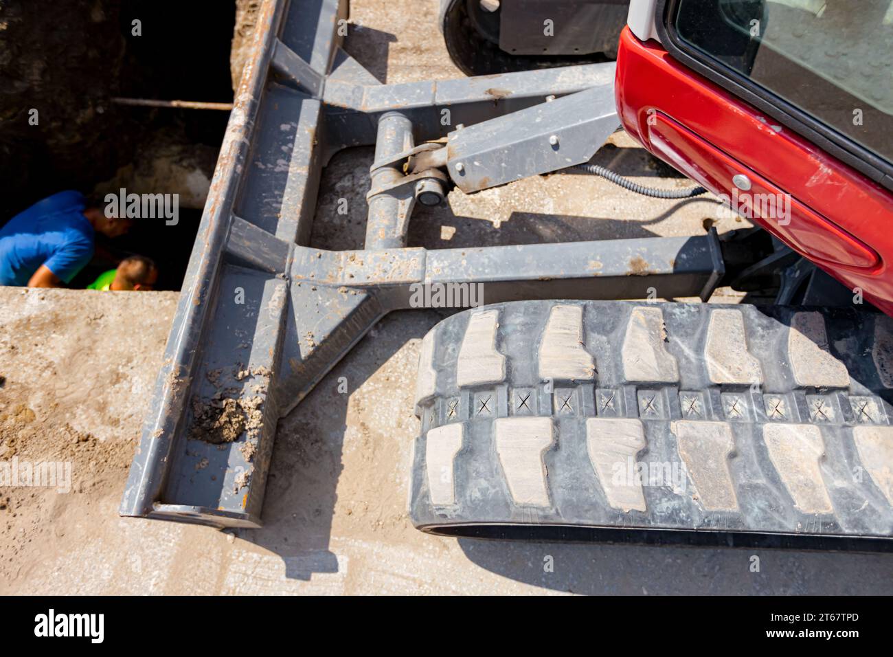 Small excavator's tool, front lower bulldozer blade, parked excavator ...