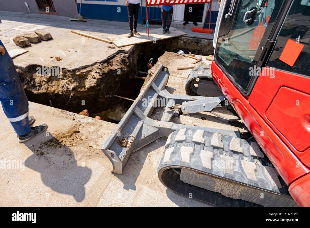 Small excavator's tool, front lower bulldozer blade, parked excavator ...