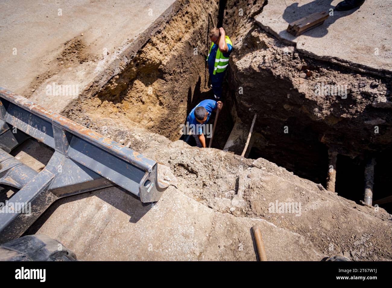 Small excavator's tool, front lower bulldozer blade, parked excavator ...