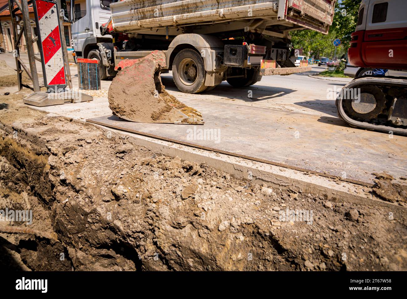 Low view on excavator's tool, front bucket, blade, parked excavator has ...